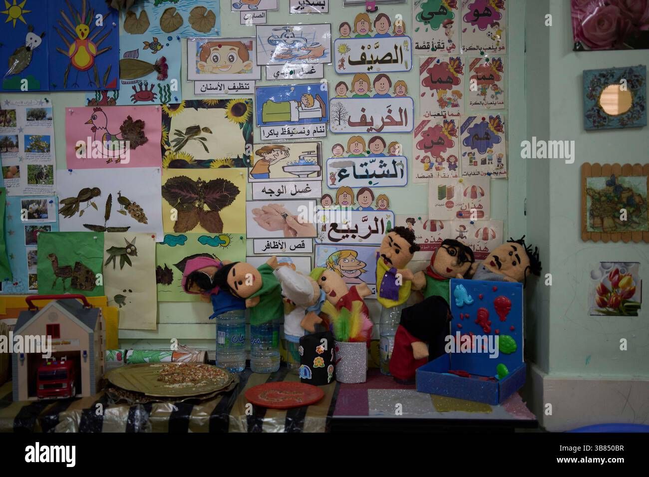 Puppets and educational materials are displayed in teacher Doaa Zourba ...