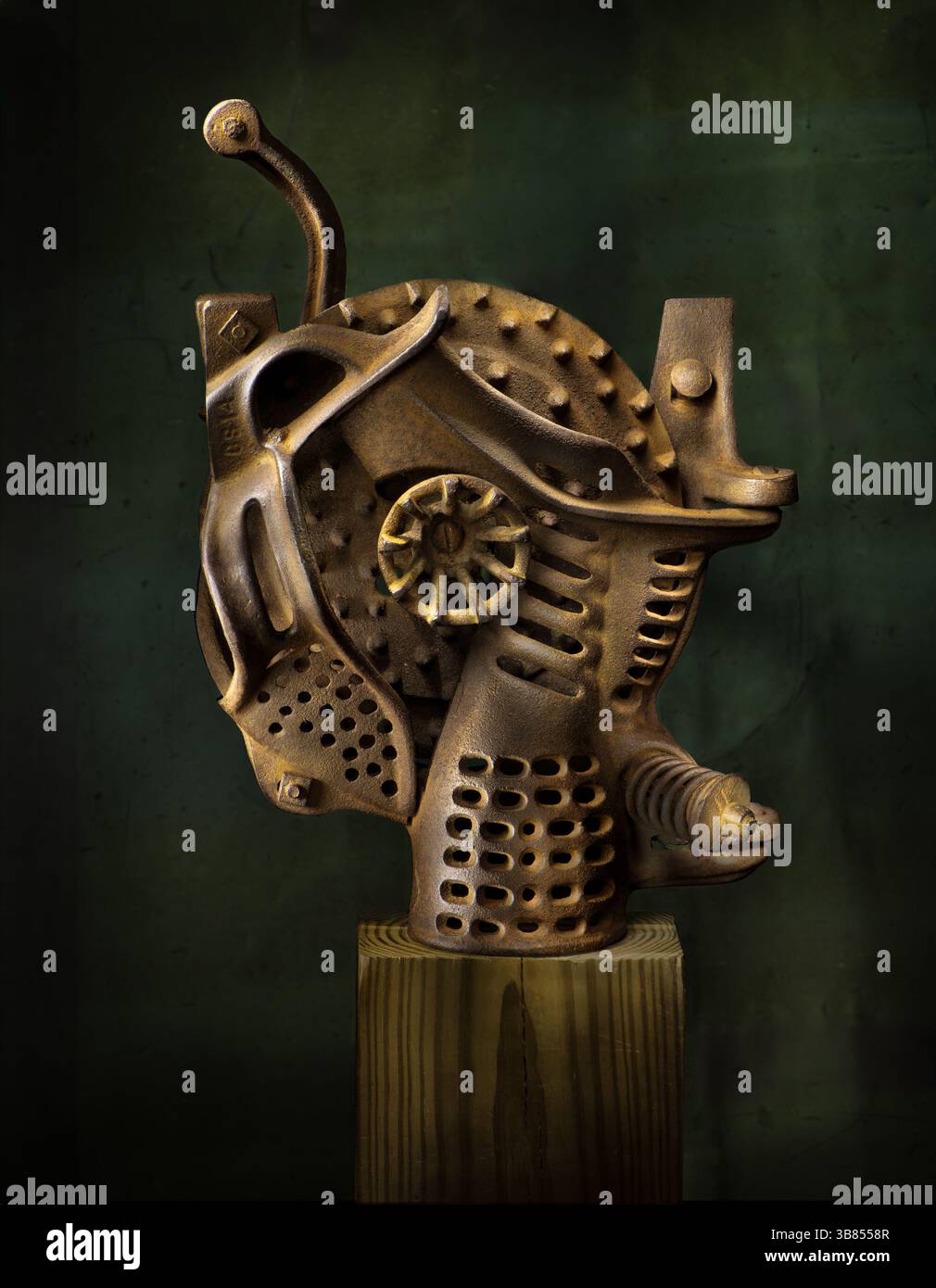 Old and rusted tool used to shell (remove the kernels from) corn cobs ...