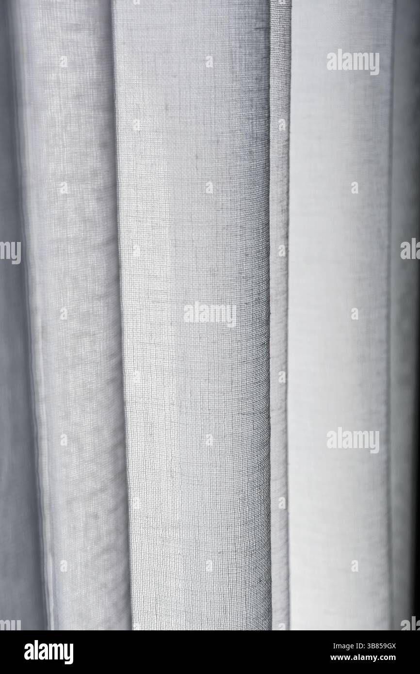 Sheer white curtain showing its delicate fabric texture. Flowing fabric ...