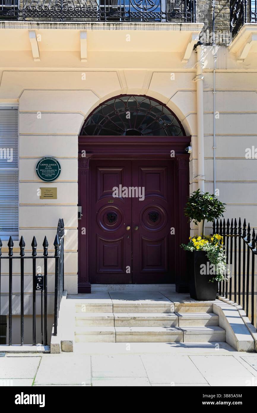 LONDON, UK - APRIL 29, 2025: Ornate door in Harley Street with memorial ...