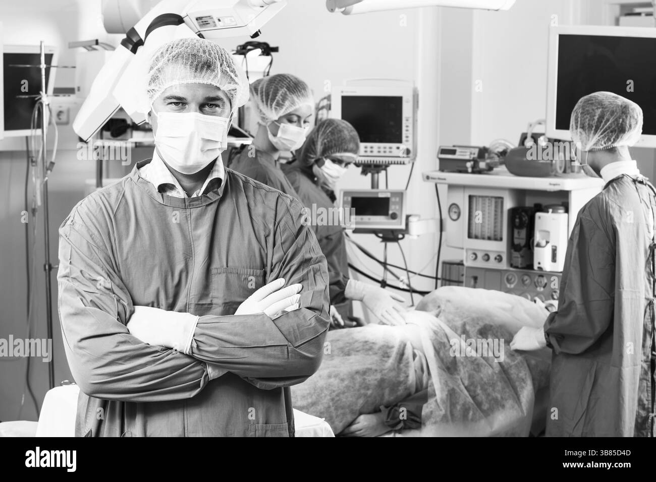 Surgery team operating in a surgical room Stock Photo - Alamy