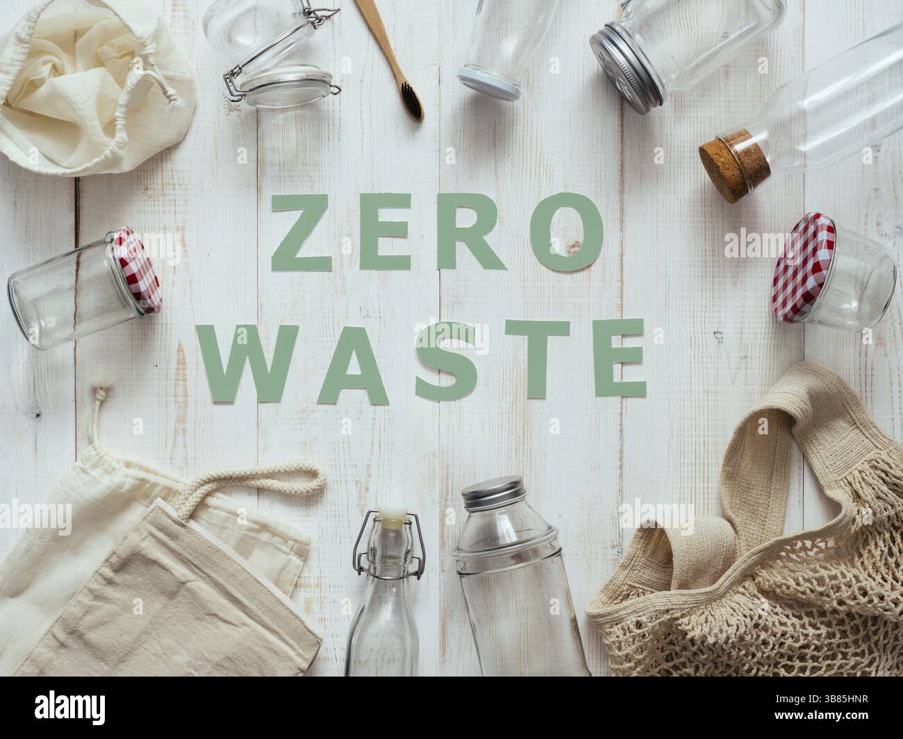 Zero waste concept. Textile eco bags, glass jars and bamboo toothbrush ...