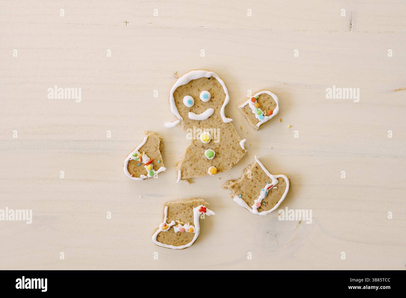 Gingerbread man with severed legs and arms. The limbs of the cookie are ...