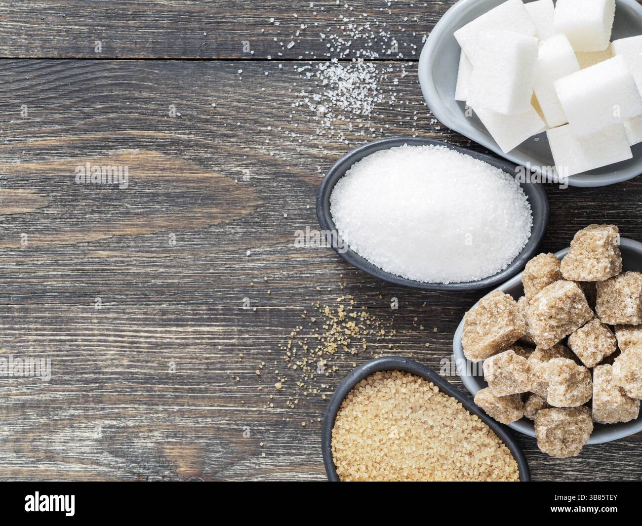 Top view of different types of sugar: natural raw brown and refined ...
