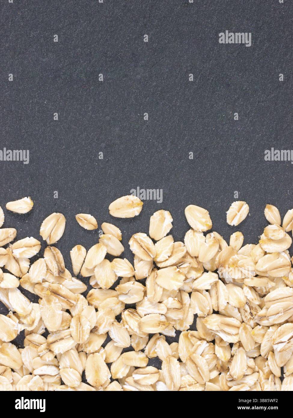 Raw oatmeal on gray hi-res stock photography and images - Alamy