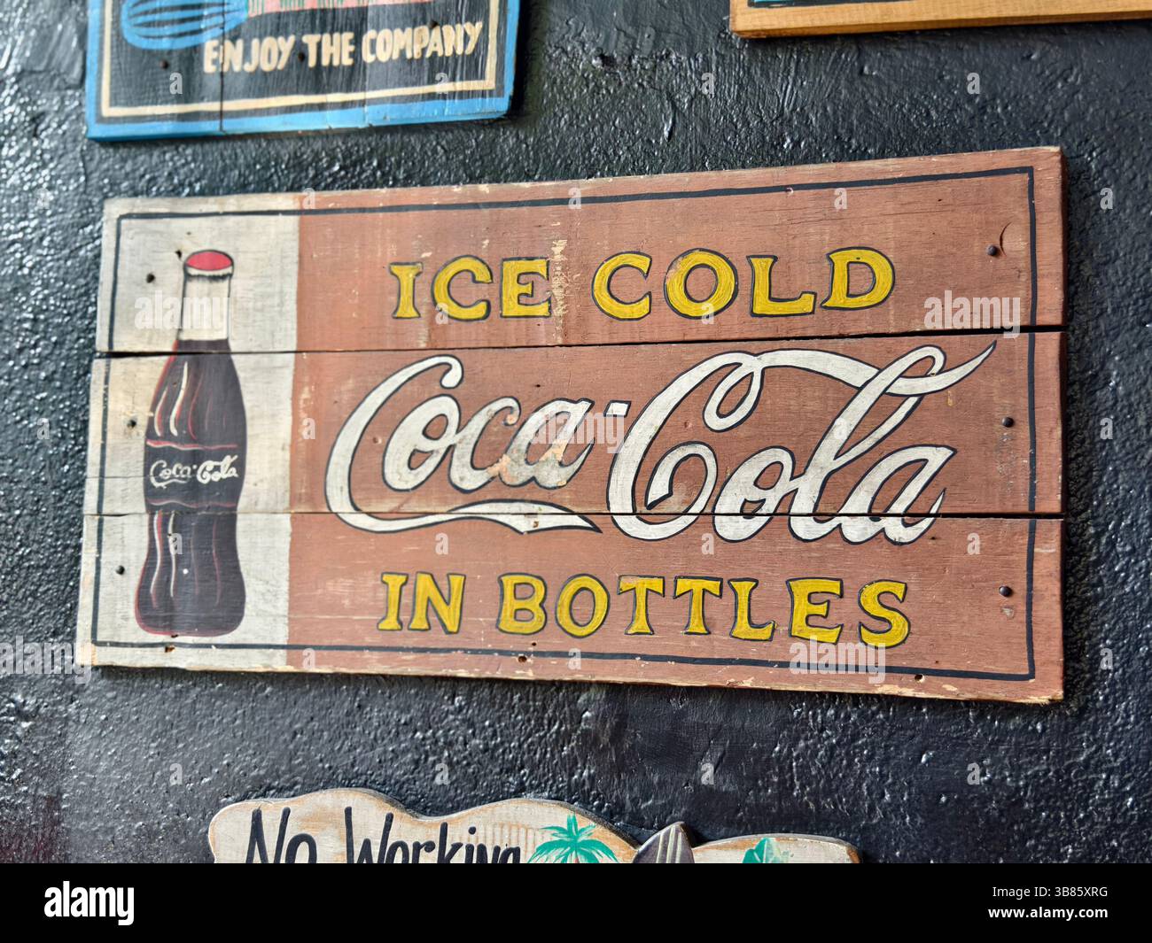 Kuta, Bali, Indonesia – April 30, 2025: A rustic, hand painted wooden ...