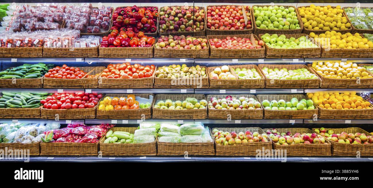 Fresh fruits and vegetables on shelf in supermarket. For healthy ...