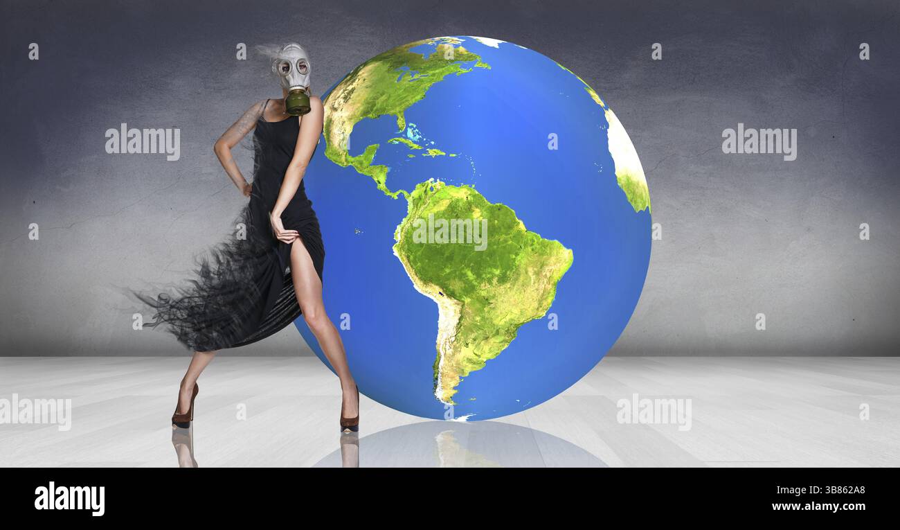 Model in gass mask posing near big earth ball in the gray room.Elements ...