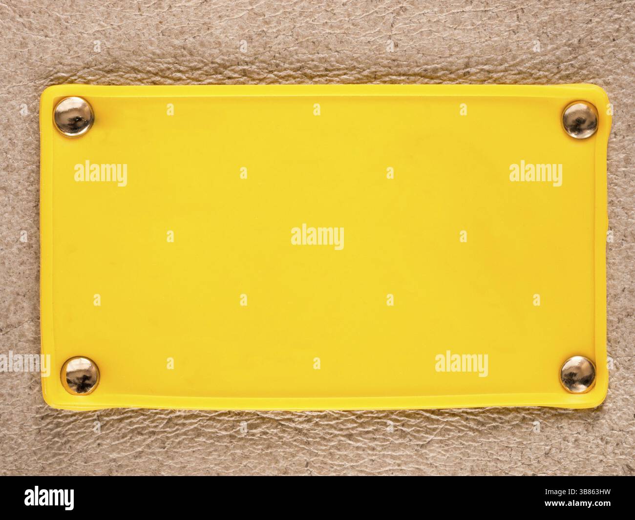 Blank yellow label on leather background for your text Stock Photo - Alamy