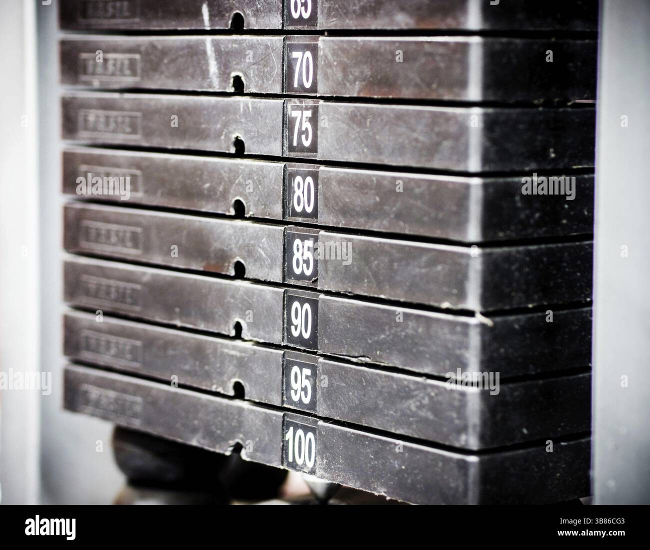 Stack of rusty metal weights in gym bodybuilding equipment. Bodybuilding concept. Hign contrast ...