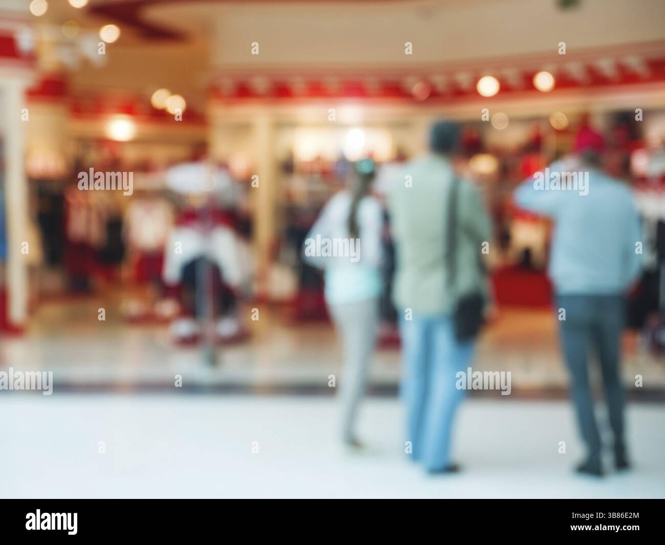 Abstract blurred shopping mall hall with unrecognizable persons as ...