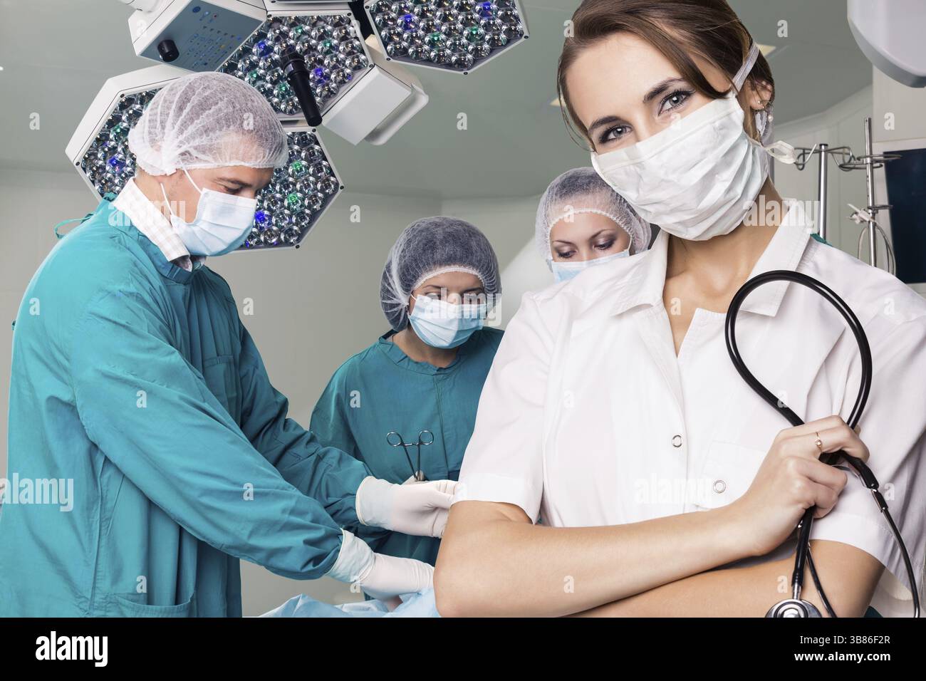 Surgery team operating in a surgical room Stock Photo - Alamy