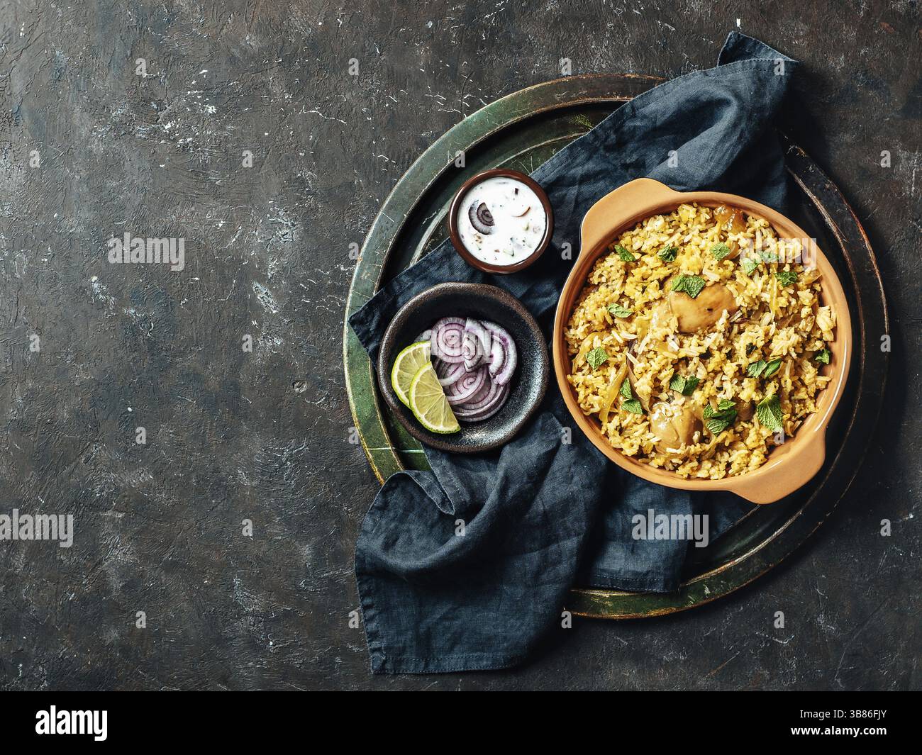 Pakistani food - biryani rice with chicken and raita yoghurt dip ...