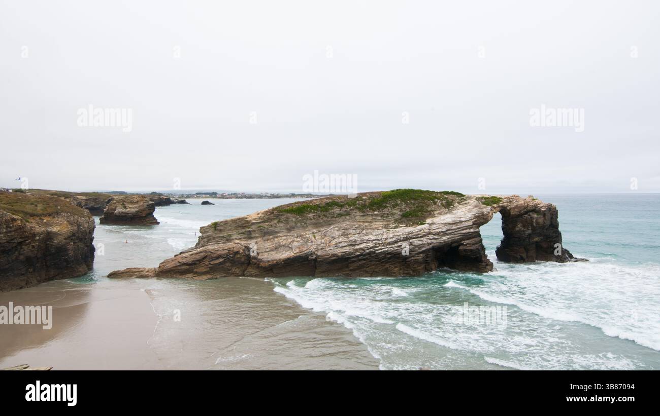 Beautiful natural arch at Cathedrals beach, Lugo, Galizia. Cloudy day ...