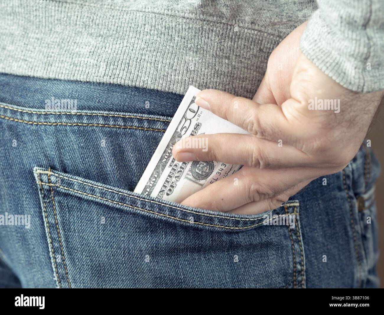 Hands put money in hi-res stock photography and images - Alamy