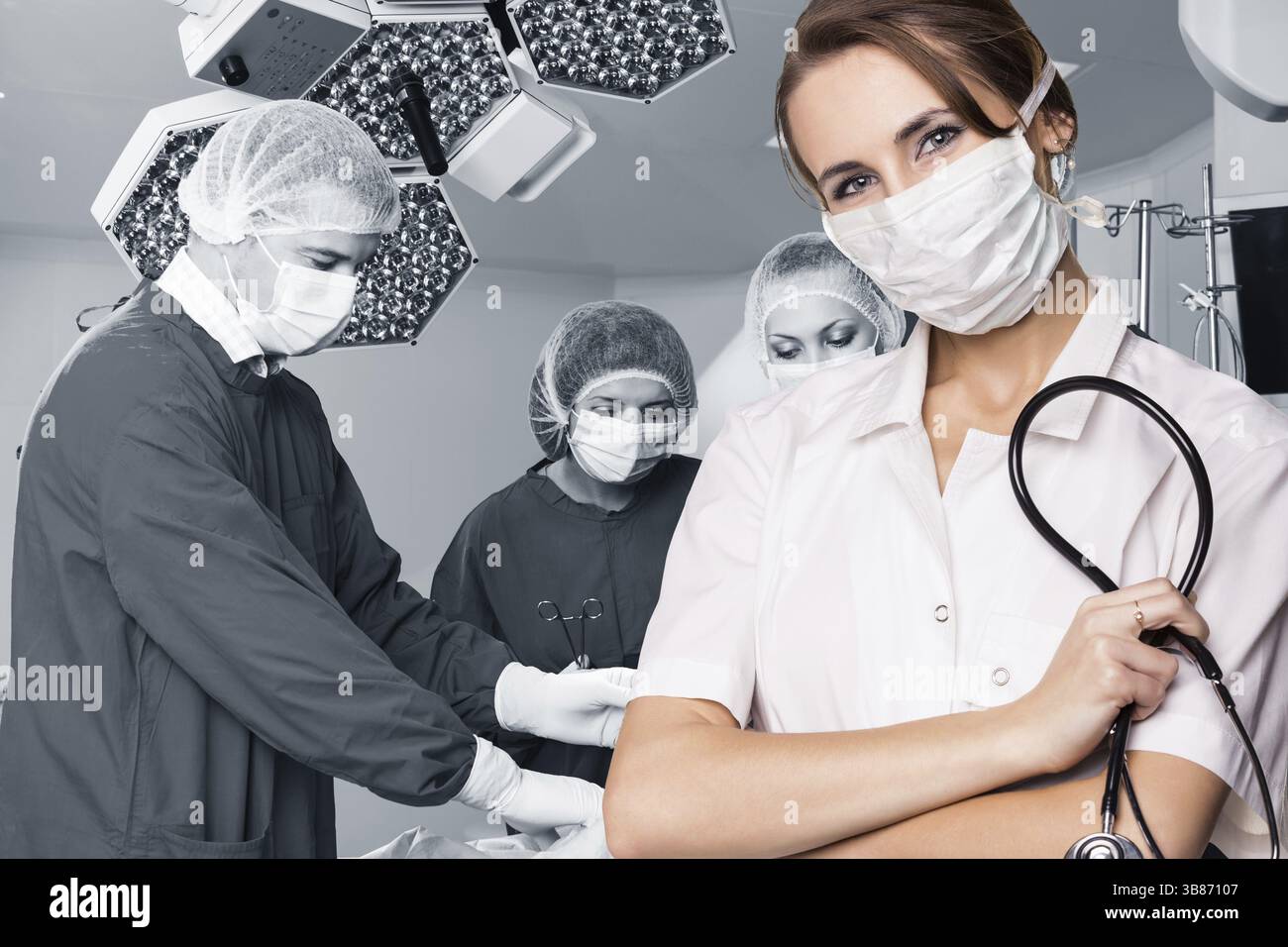 Surgery team operating in a surgical room Stock Photo - Alamy
