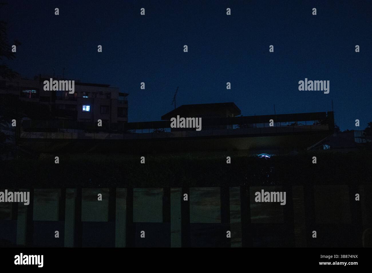 A blackout is seen during a mock drill to train civilians in case of ...