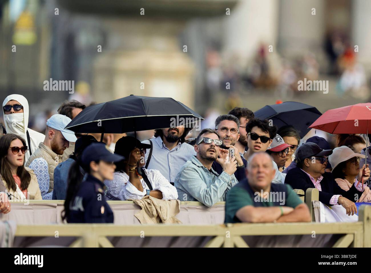 VATICAN POPE VOTE CONCLAVE people in st. peter s square watch the ...