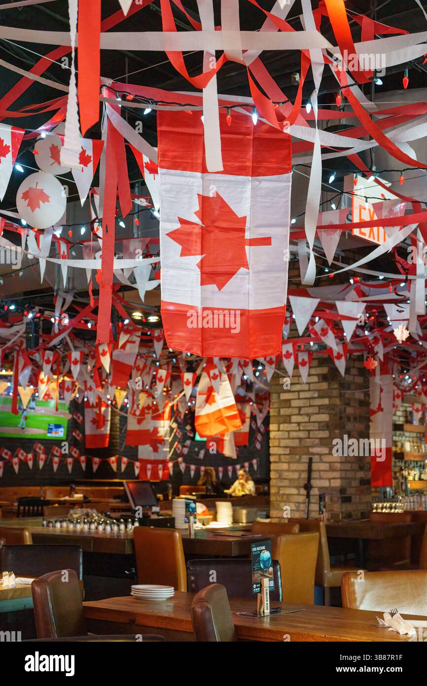 Interior of Jack Astor’s restaurant decorated with multiple Canadian ...