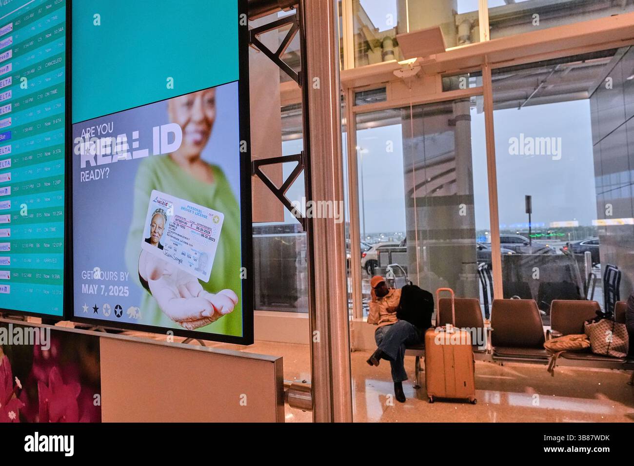 Signage reminds travelers of the new Real ID mandate at Louis Armstrong ...