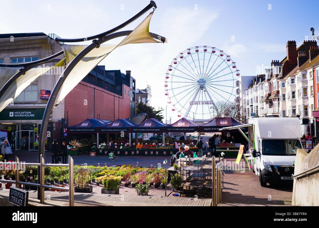 The open air market at Worthing with big wheel in background Stock ...