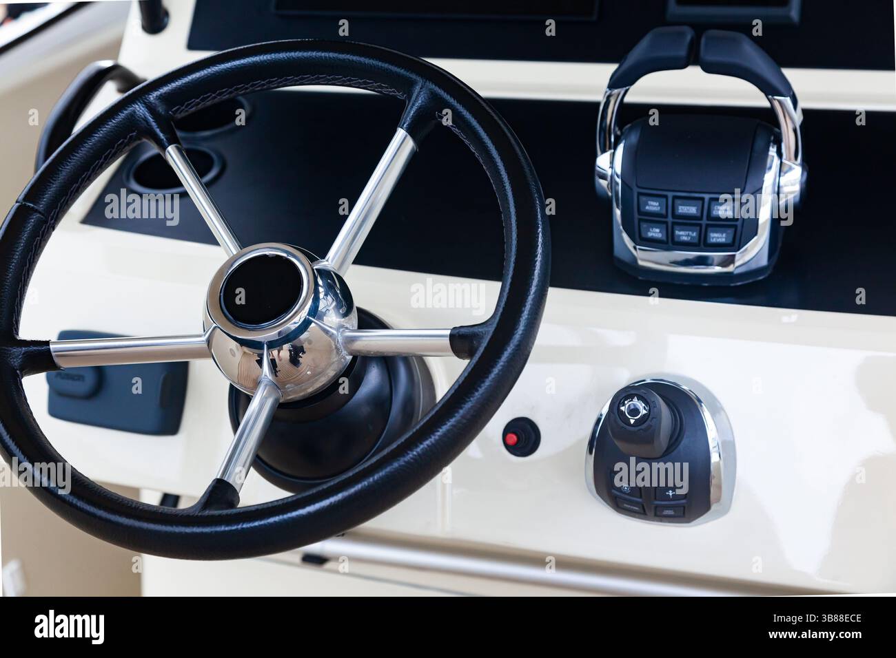 Luxury yacht control panel with steering wheel, gear levers, navigation ...