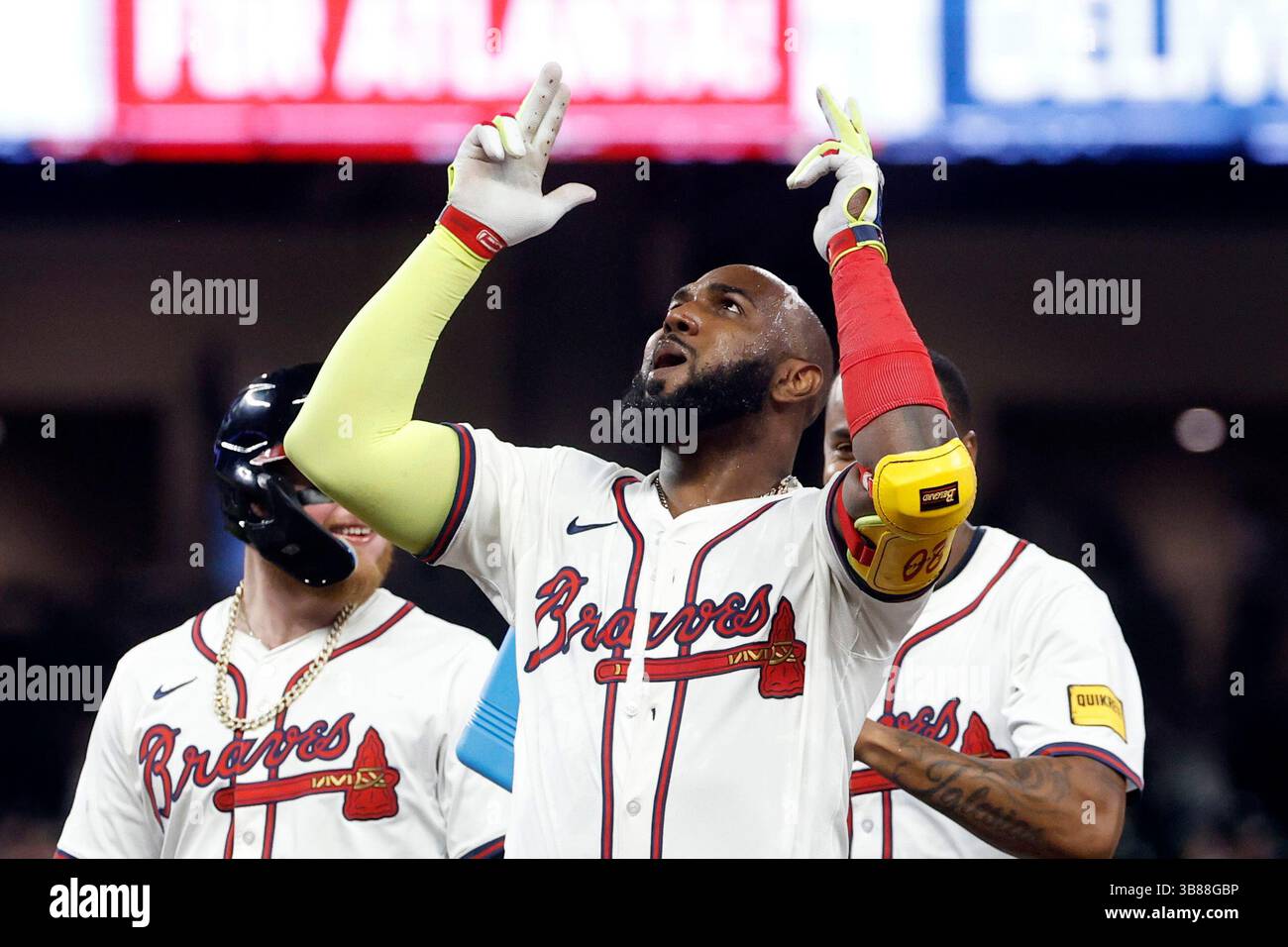 Atlanta Braves designated hitter Marcell Ozuna reacts after hitting a ...