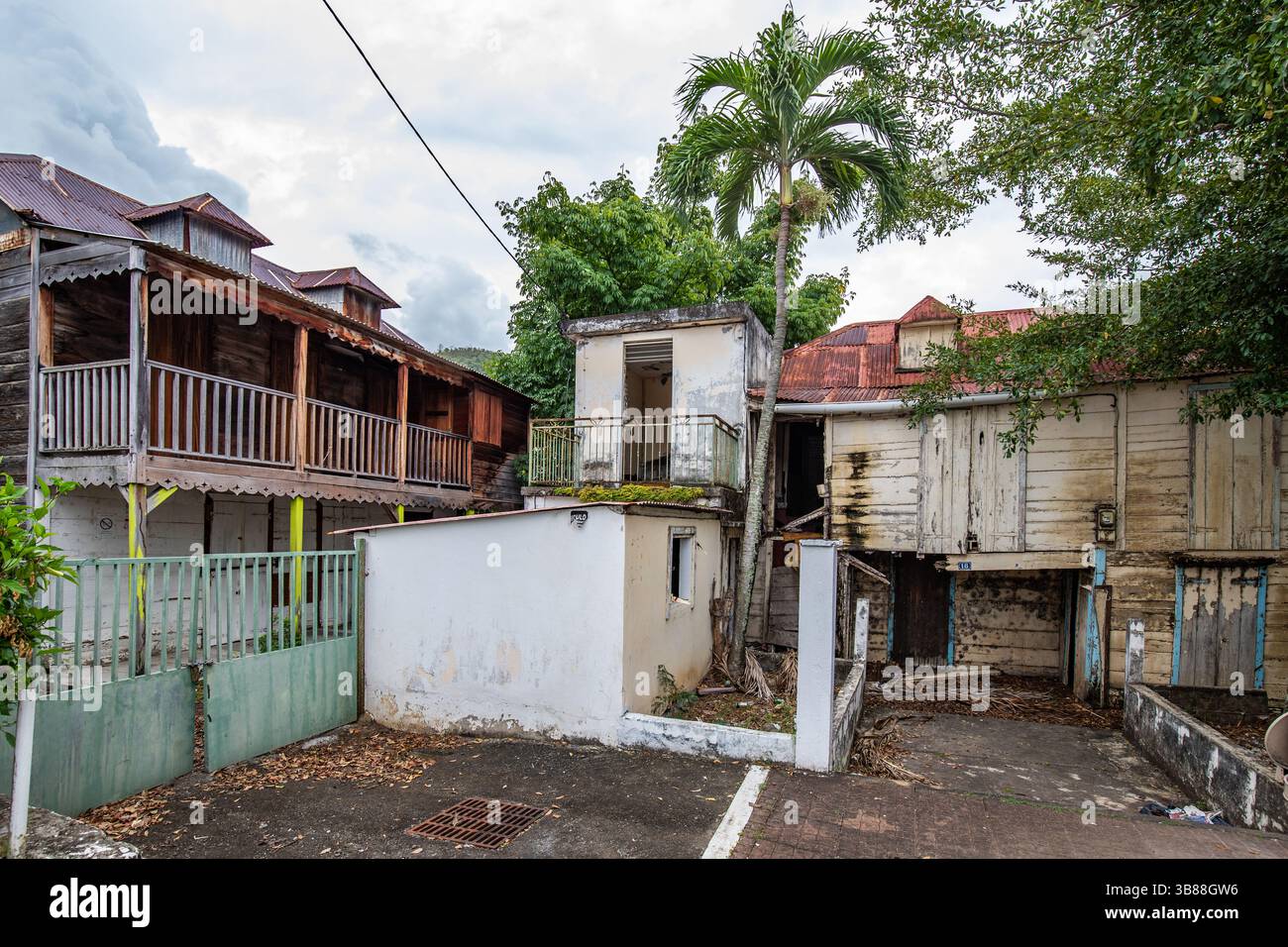 Deshaies, historic Caribbean wooden buildings on a street in Guadeloupe ...