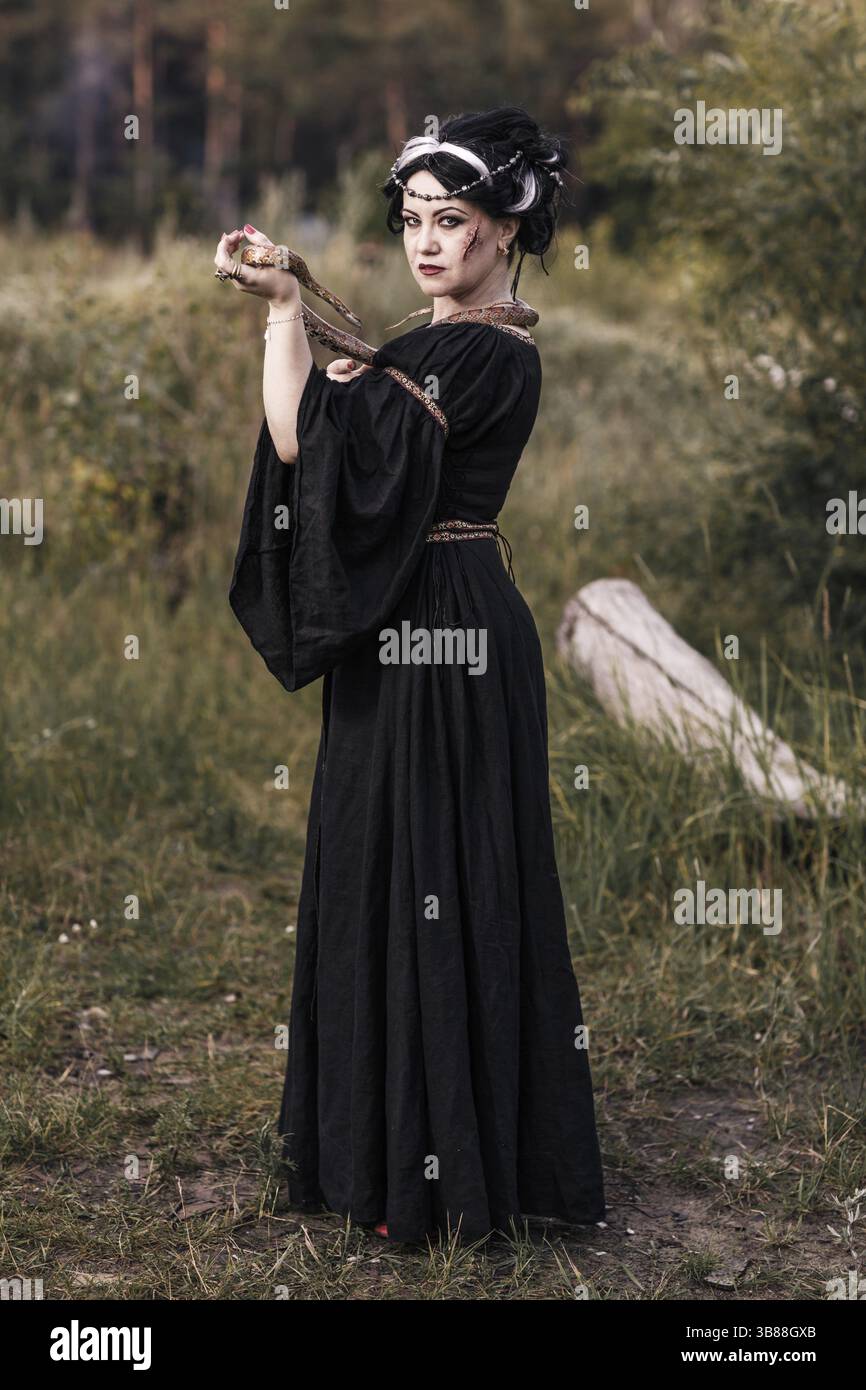 Evil witch woman casting a spooky spell with magic hands. Witchcraft ...