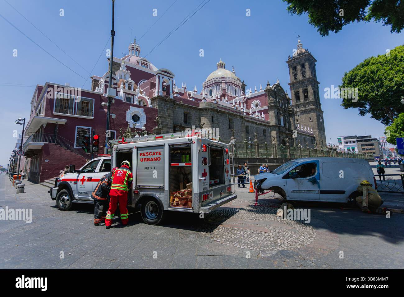 A fire truck and rescue team simulate the extraction of victims from a ...
