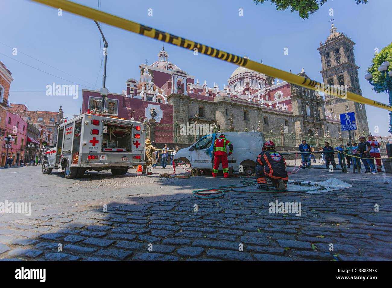 A fire truck and rescue team simulate the extraction of victims from a ...