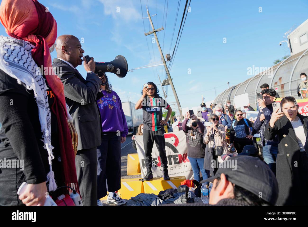 Newark Mayor Ras Baraka speaks to protesters outside of Delaney Hall, a ...