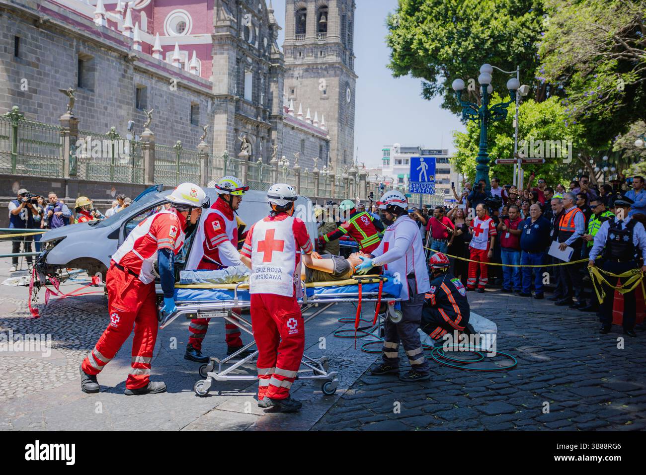 A fire truck and rescue team simulate the extraction of victims from a ...