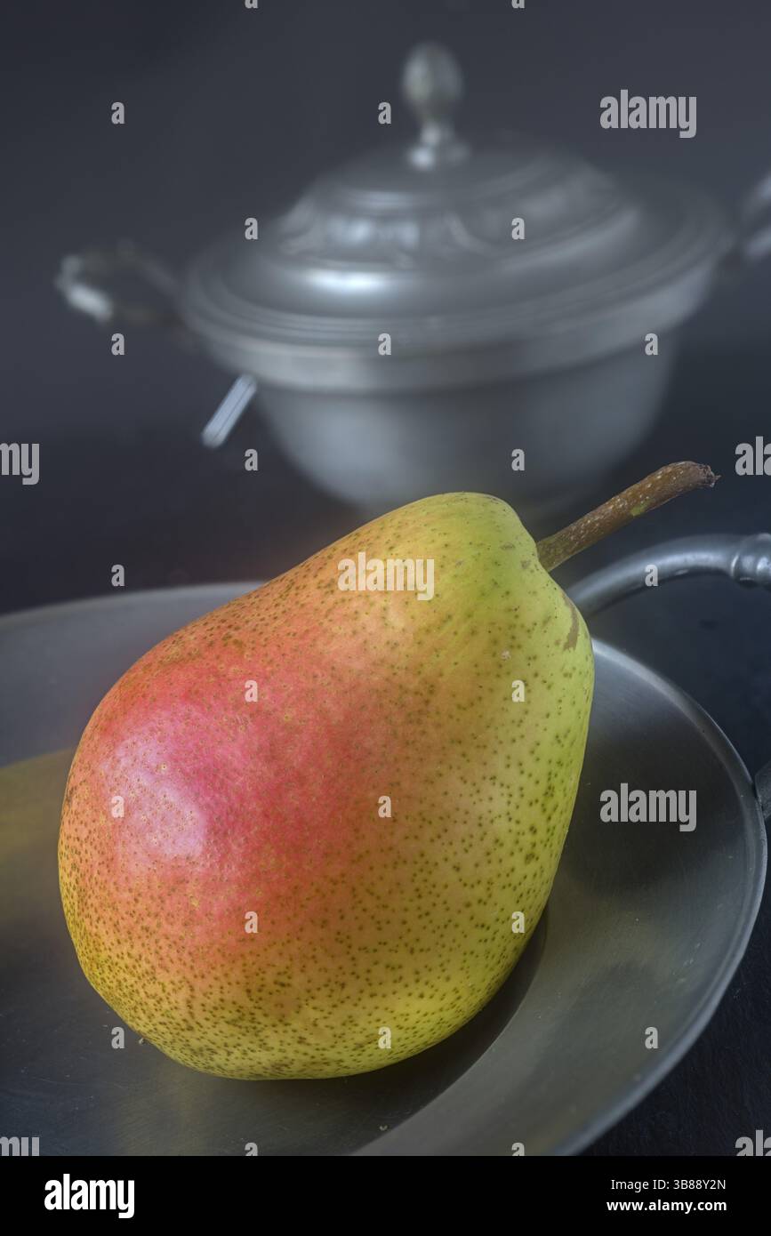 Santa Maria pear in pewter bowl Stock Photo - Alamy