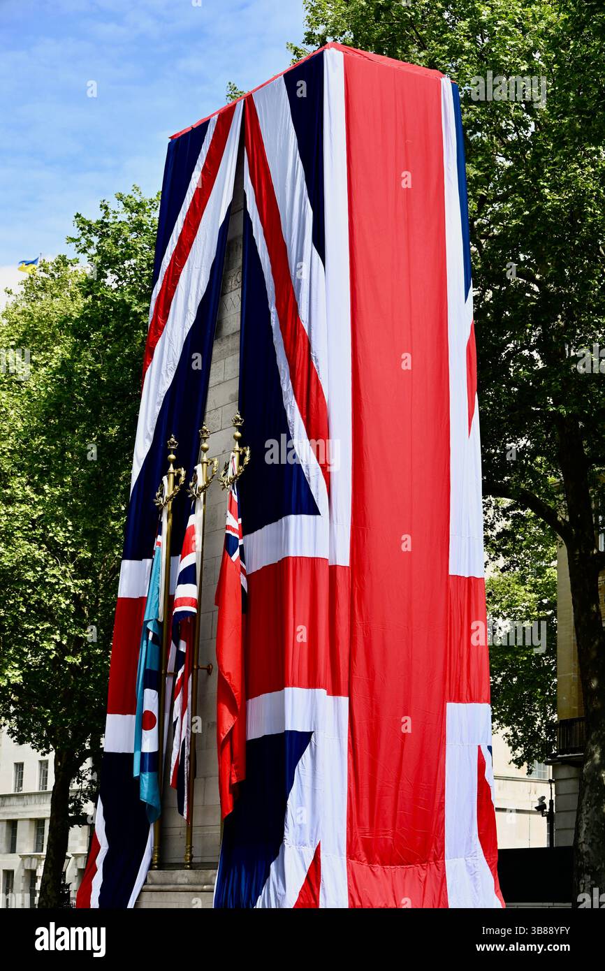 London, UK. Cenotaph in Whitehall draped in a Union Jack in homage to ...