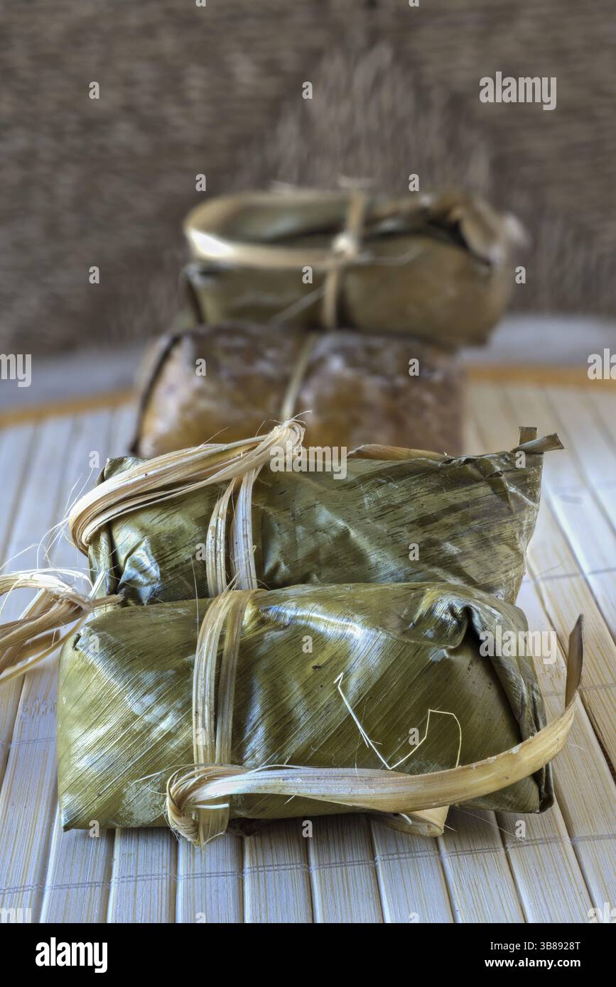Sticky rice cake with taro in banana leaves Stock Photo - Alamy