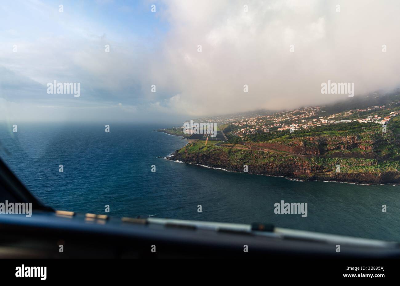Cockpit view of final approach to Madeira airport over the Atlantic ...