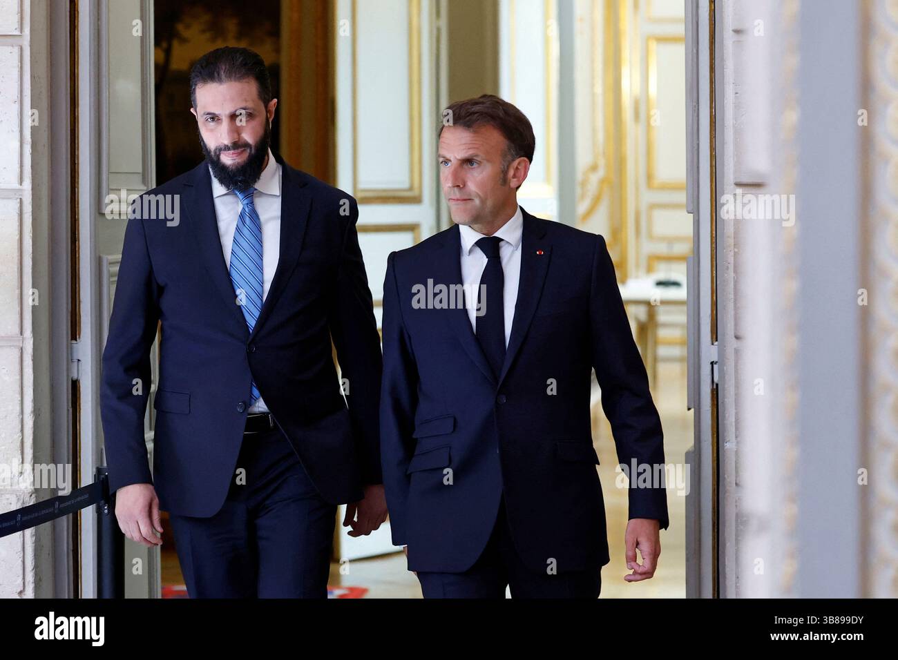 Syria's interim President Ahmad al-Sharaa, left, and French President Emmanuel Macron arrive for ...