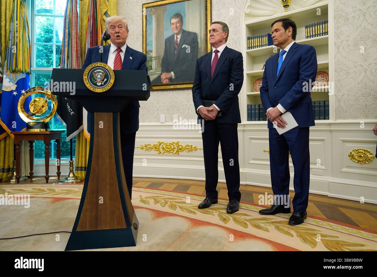 President Donald Trump before David Perdue is sworn in as U.S ...