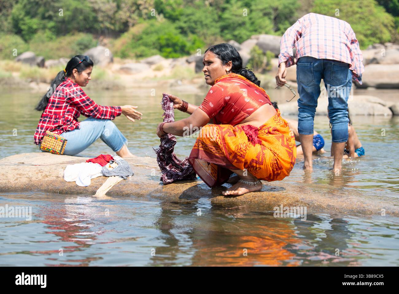 Indian woman washing clothes hi-res stock photography and images - Alamy