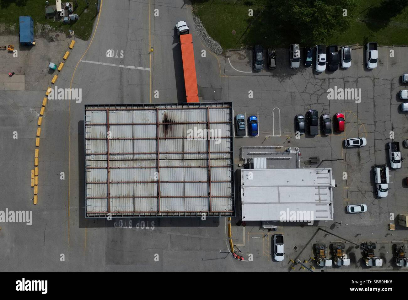 A semi-trailer truck pulls out of the CSX Intermodal Terminals, a ...