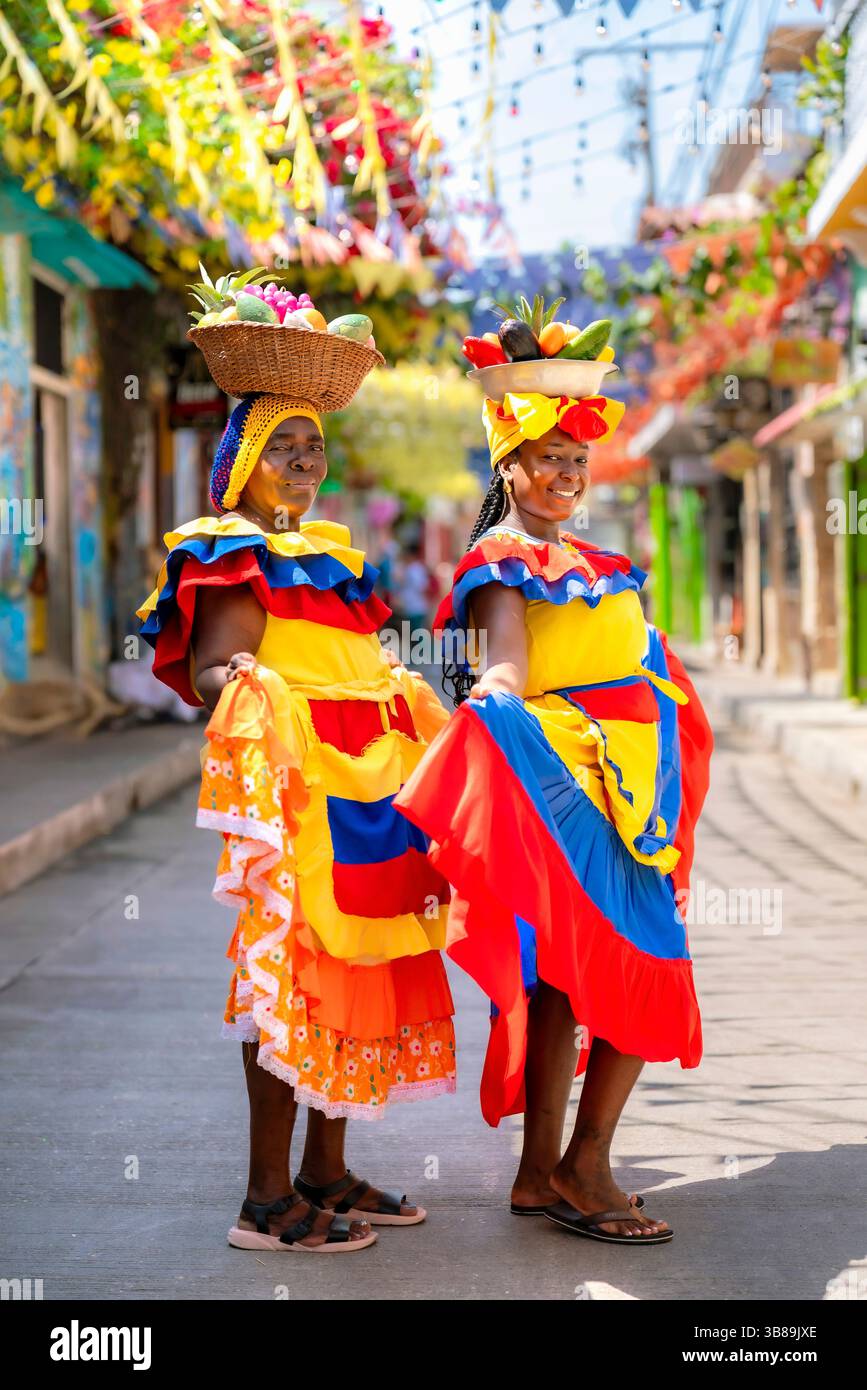Colombia, Cartagena - April 16, 2025: Two joyful Latina Palenqueras ...