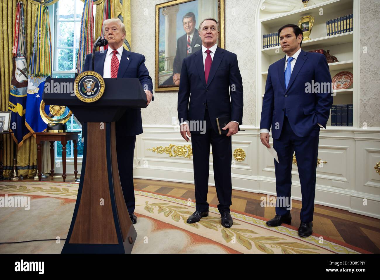 President Donald Trump stands with former U.S. Senator David Perdue ...