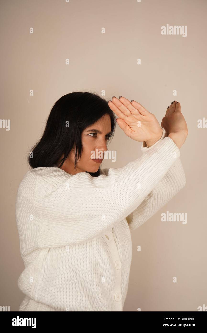 The gesture shows determination and resolve. A woman crosses her arms ...