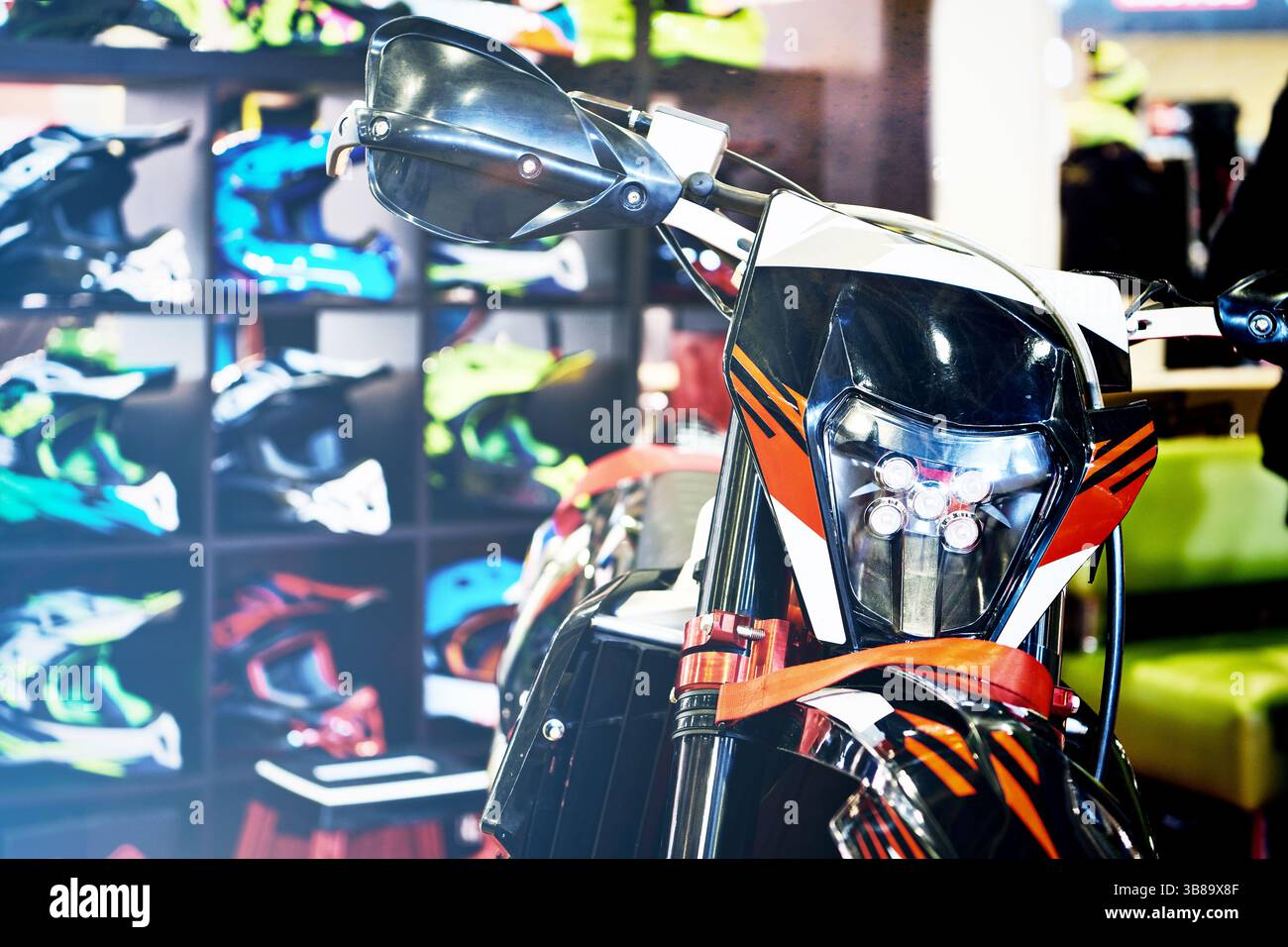 Motorcycle and racing helmets in sport store Stock Photo - Alamy