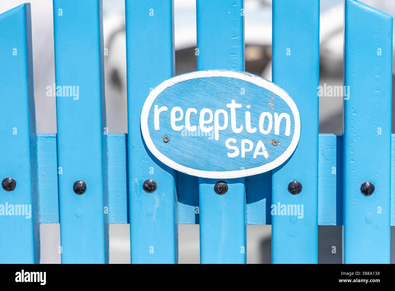 Blue picket spa entrance gate in Cycladic architecture with white stone ...