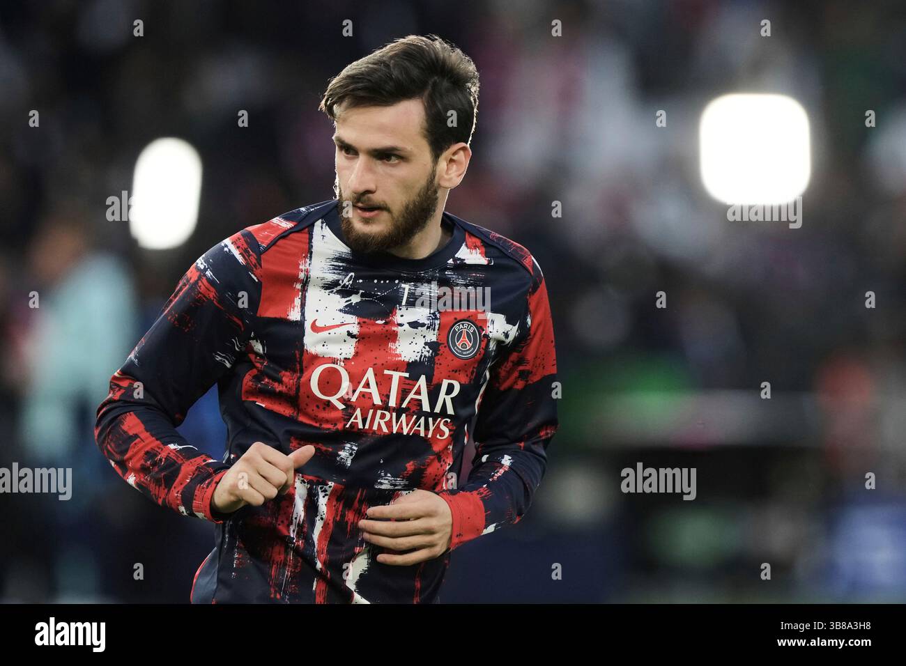 PSG's Khvicha Kvaratskhelia warms up before the Champions League ...