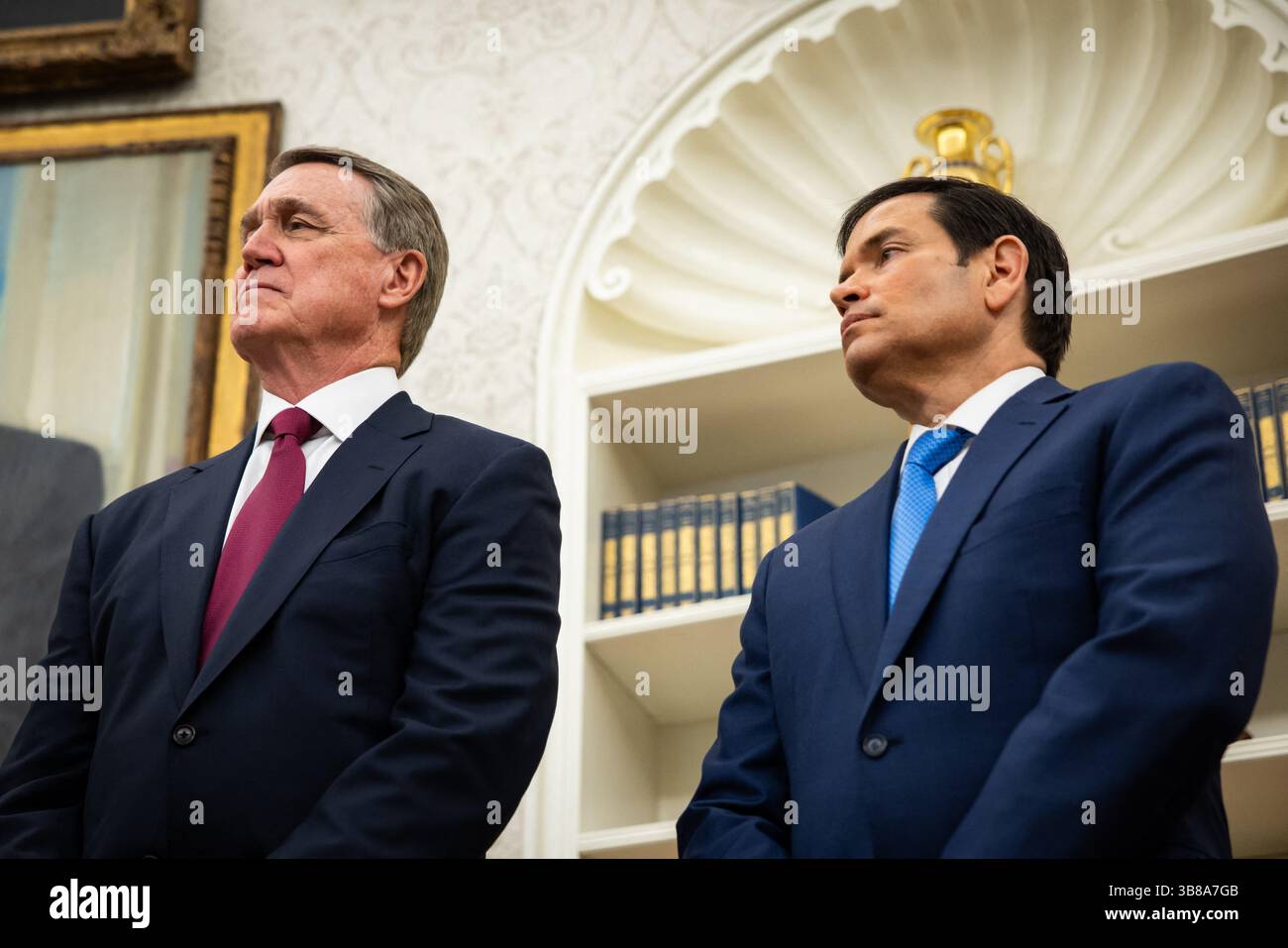 Former U.S. Senator David Perdue (left) stands with U.S. Secretary of ...