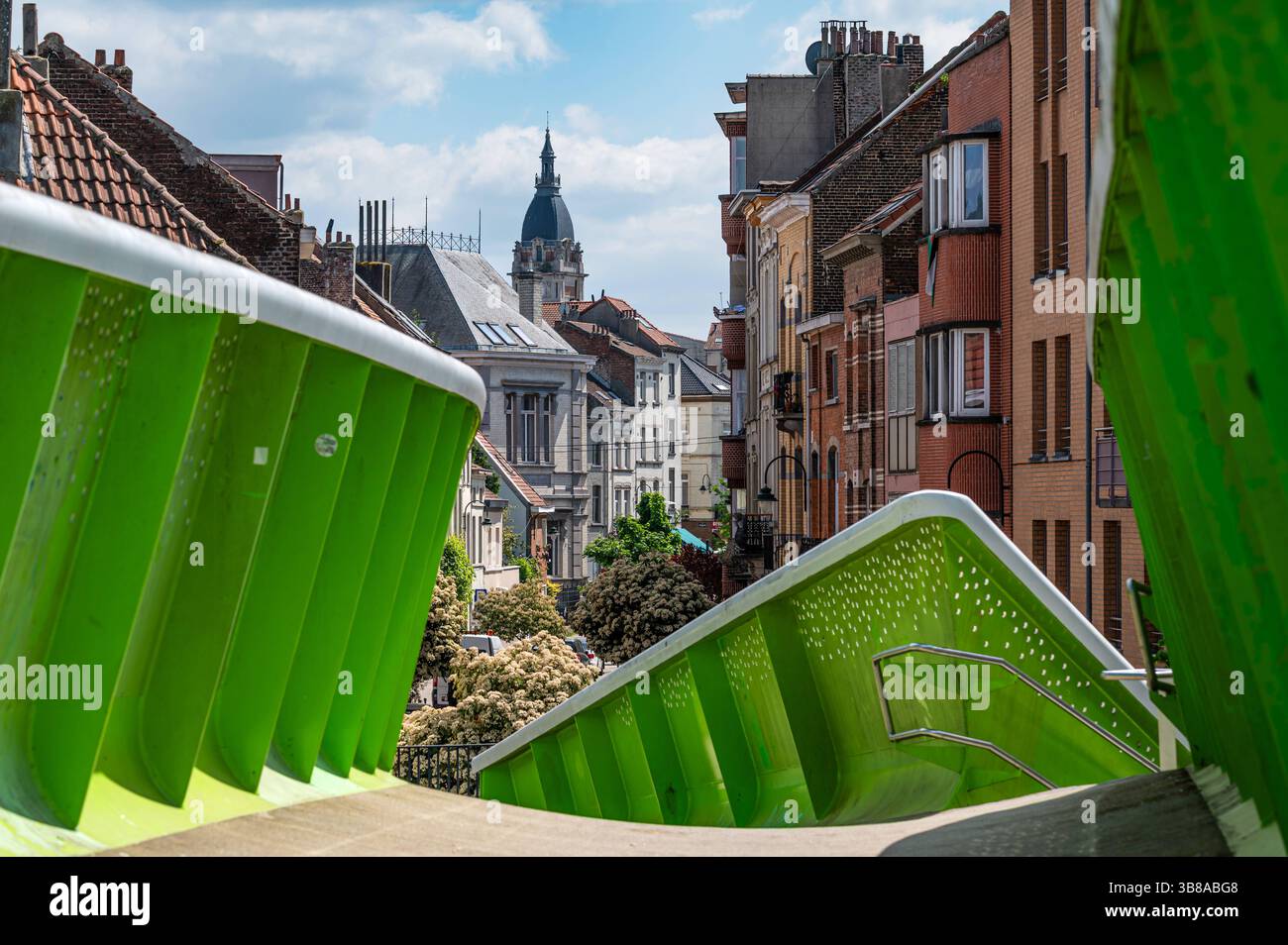 Green pedestrian bridge over railway in a social borrow of Laeken ...