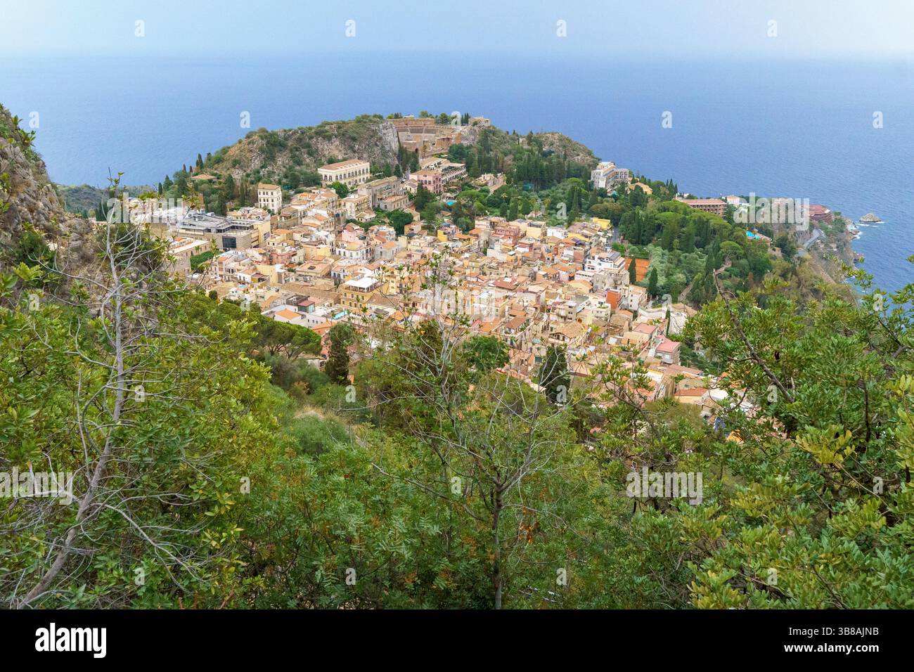View from above Taormina with the medieval city center, the ancient ...